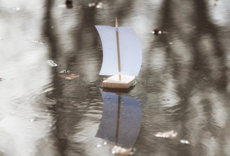 A Wooden Boat with a Sail Swims Along the Spring Water Stock Photo ...