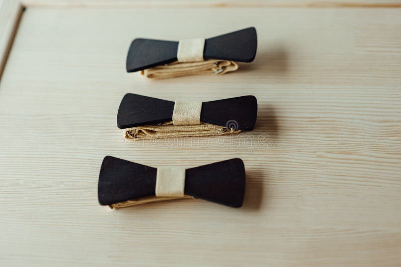 Wooden Bow Ties on a Ivory Table Stock Photo - Image of knot, drilled ...
