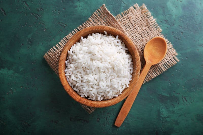 Wooden Bowl with Boiled White Rice on Color Table Stock Photo - Image ...