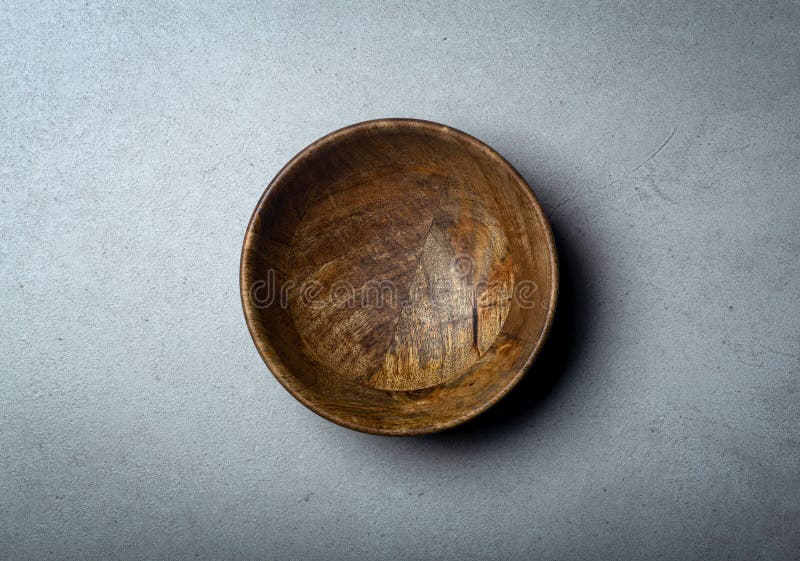 Wooden Bowl on a Concrete Stone Surface. Texture and Texture of Wood ...
