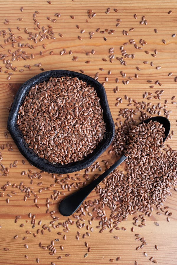 Wooden Bowl of Organic Flaxseed or Linseed on Rustic Table Top View ...