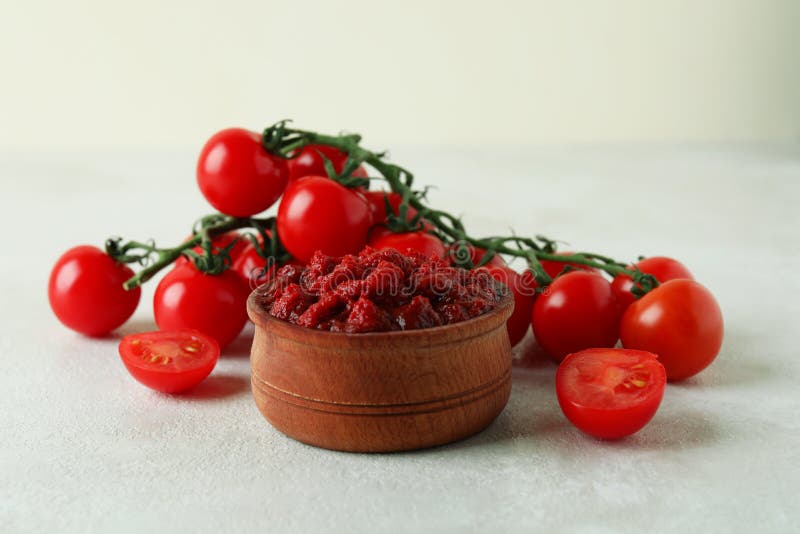 Wooden Bowl with Tomato Paste and Tomatoes on White Textured Table ...