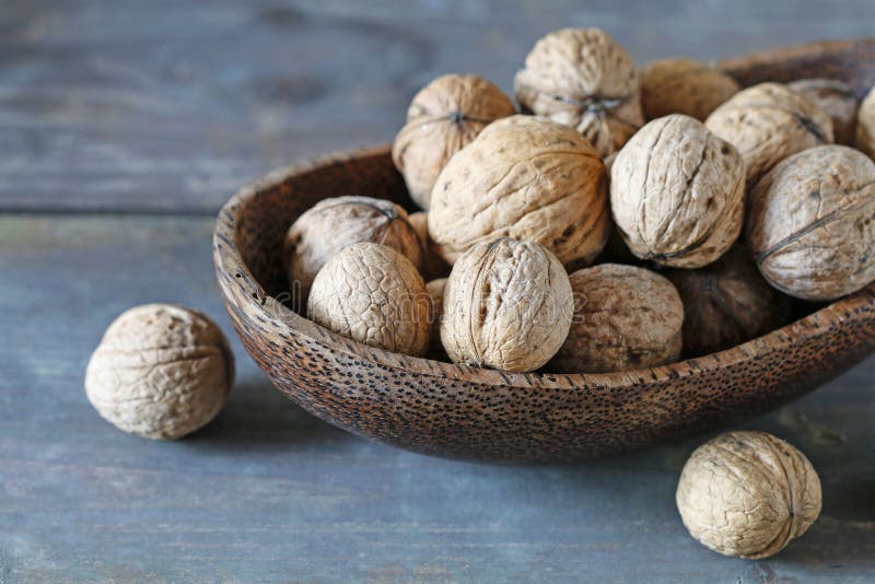Wooden Bowl with Walnuts on the Table Stock Image - Image of nutshell ...