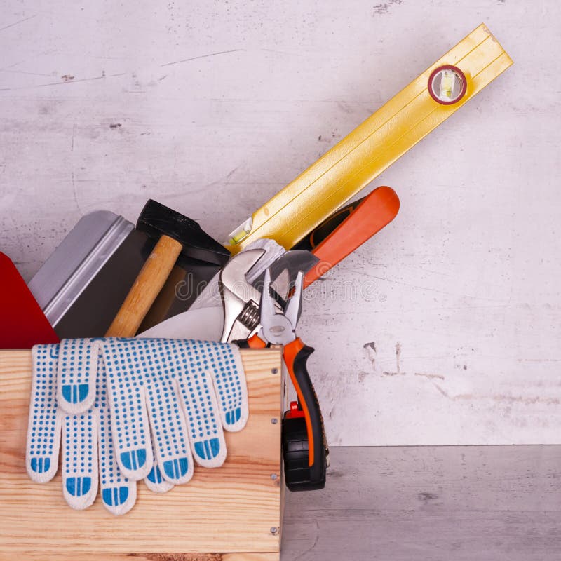 Wooden Box with Construction Tools on a Light Concrete Background ...