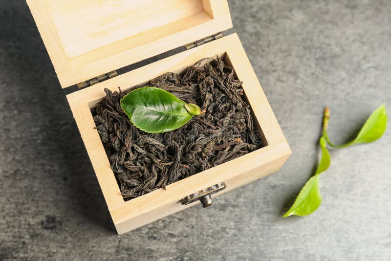 Wooden Box with Dry Tea and Green Leaves Stock Photo - Image of ...