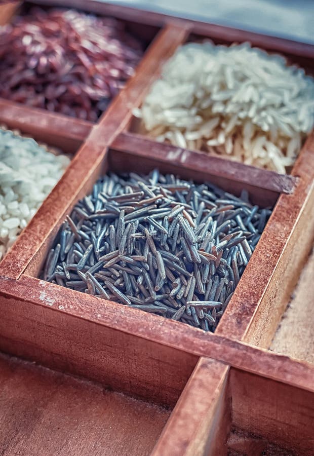 Wooden Box with Four Sections Filled with Rice Red and Black Close-up ...