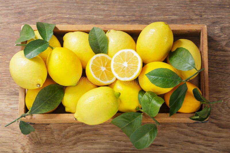 Wooden Box of Fresh Lemons with Leaves, Top View Stock Photo - Image of ...