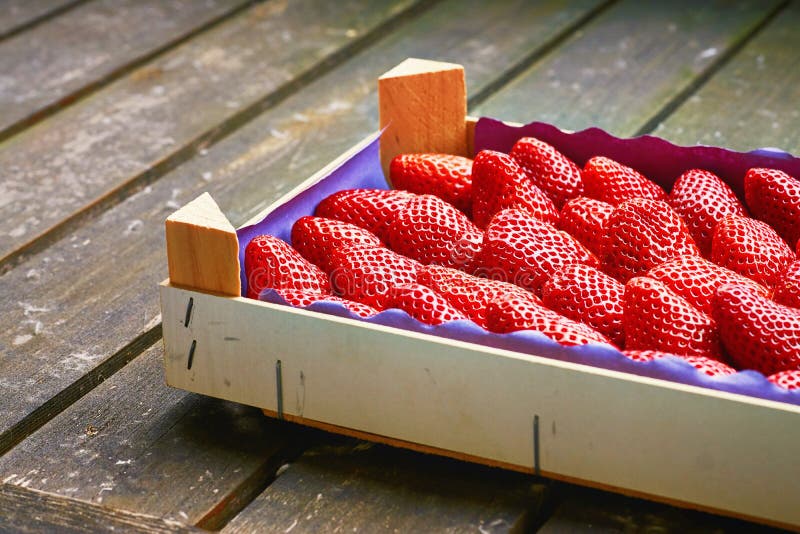 Wooden Box with Fresh Red Strawberries on an Old Wooden Table Stock ...