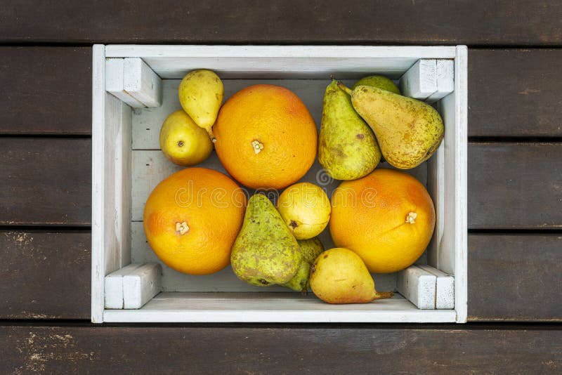 A Wooden Box Full of Ripe Citrus and Assorted Pears Stock Image - Image ...