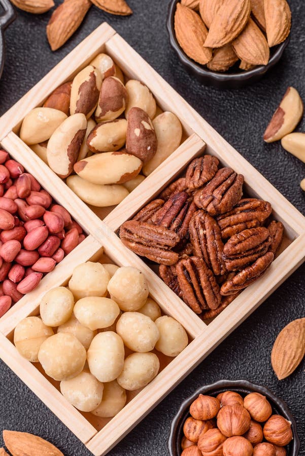 Wooden Box with Macadamia Nuts, Brazil Nuts, Pecans and Peanuts Stock ...