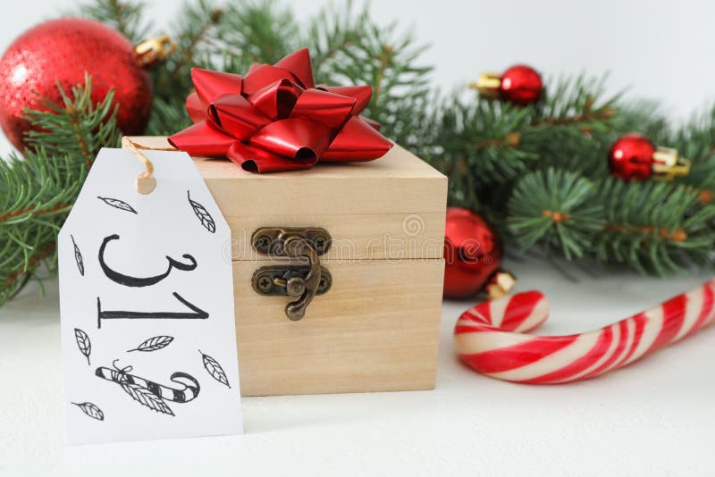 Wooden Box with Red Bow and Tag on White Table. Advent Calendar Stock ...