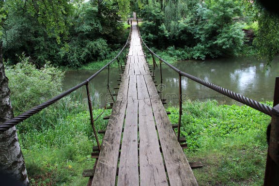 Wooden Bridge Across the River Stock Photo - Image of park, forest ...