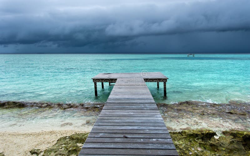 Wooden Bridge on Beach Extended into the Sea Stock Image - Image of ...