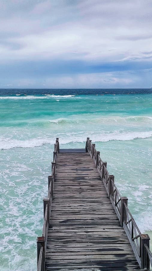 Wooden Bridge on the Beach Leading To the Open Sea Stock Photo - Image ...