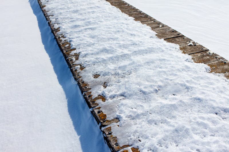 A Wooden Bridge Covered in Snow Stock Photo - Image of wooden, city ...