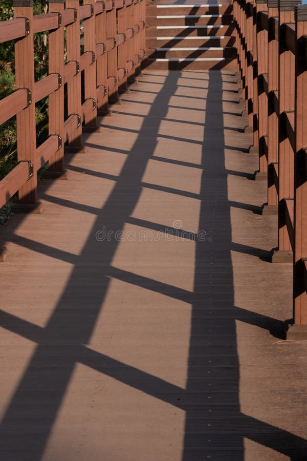 A Wooden Bridge with Evening Shadow Stock Image - Image of bridge ...