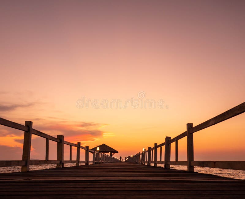 Wooden Bridge Extending into the Sea on the Beach Stock Photo - Image ...