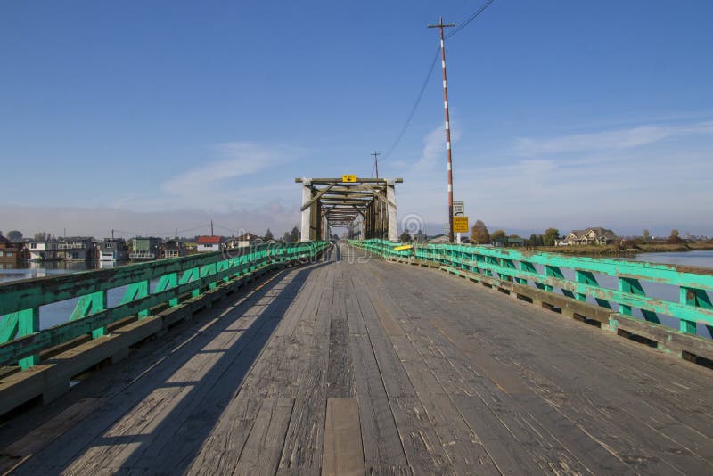 A Wooden Bridge Going Over a River Stock Photo - Image of river, bridge ...
