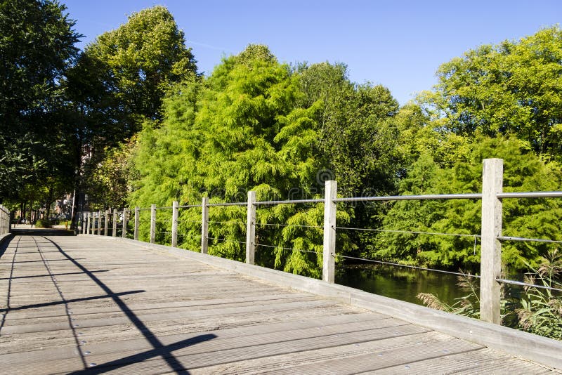 Wooden Bridge in Green Garden in the Afternoon Stock Image - Image of ...