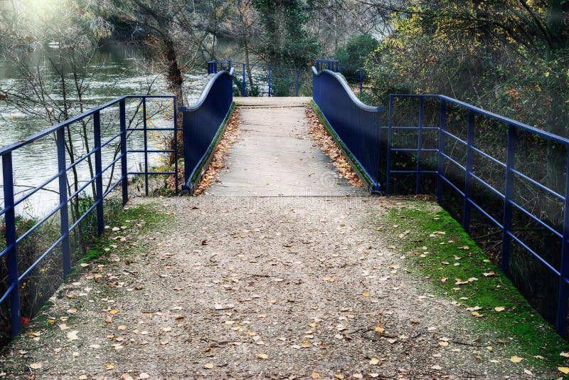 Wooden Bridge with Metal Railing Over the River Stock Image - Image of ...