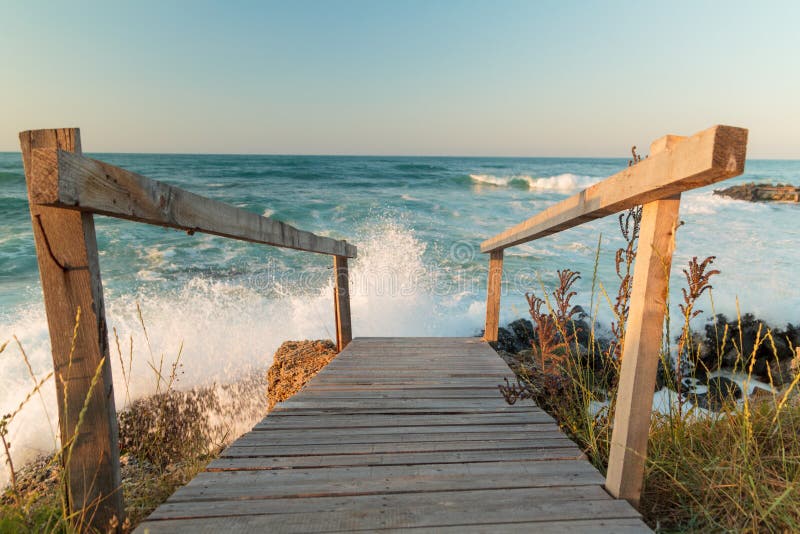 Wooden Bridge On The Beach And Beautiful Sunset Near The Sea Stock ...