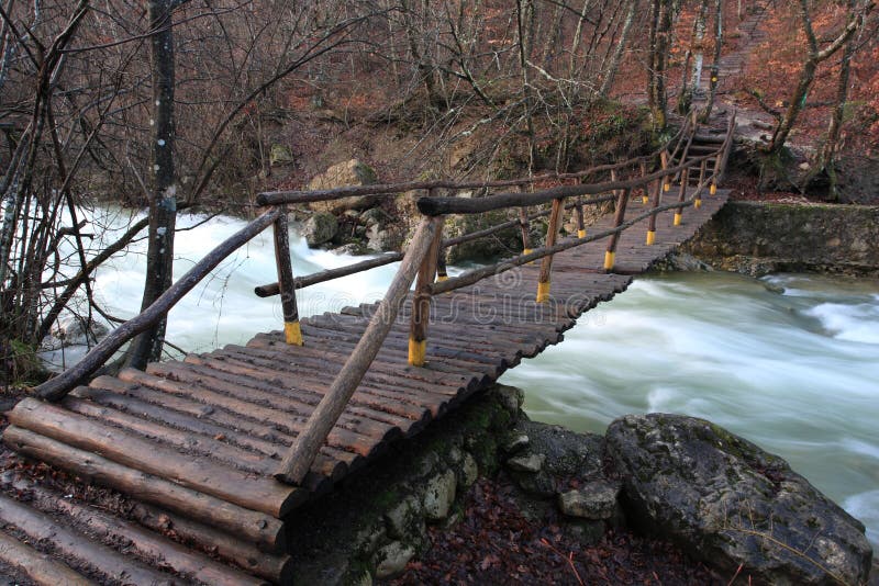 Wooden Bridge Over Mountain River Stock Photo - Image of safety, brown ...