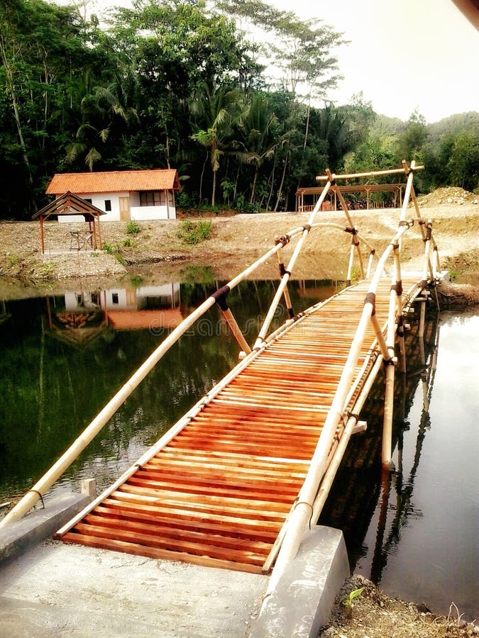 Wooden Bridge Over a Puddle of Water from a Quarry Stock Image - Image ...
