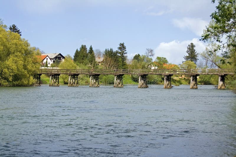 Wooden bridge over river stock image. Image of scenery - 4993221
