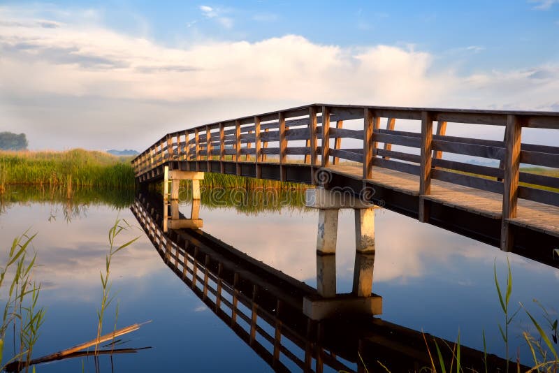 Wooden bridge over river stock photo. Image of sunny - 31933888