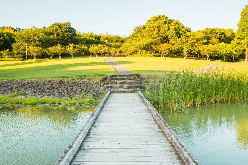 A Wooden Bridge Over the River Stock Image - Image of pebble, line ...