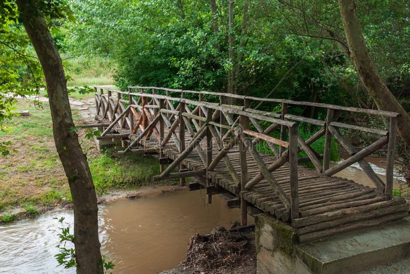 Wooden Bridge Over a Stream Stock Photo - Image of rail, hiking: 58780736