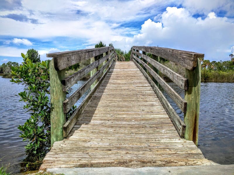 Wooden Bridge over water stock image. Image of water - 61417885