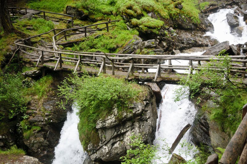 Wooden Bridge Over Waterfall Stock Image - Image of hiking, hike: 23840239