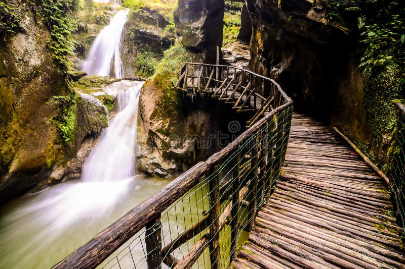 A Wooden Bridge Over a Waterfall Stock Image - Image of fall, water ...