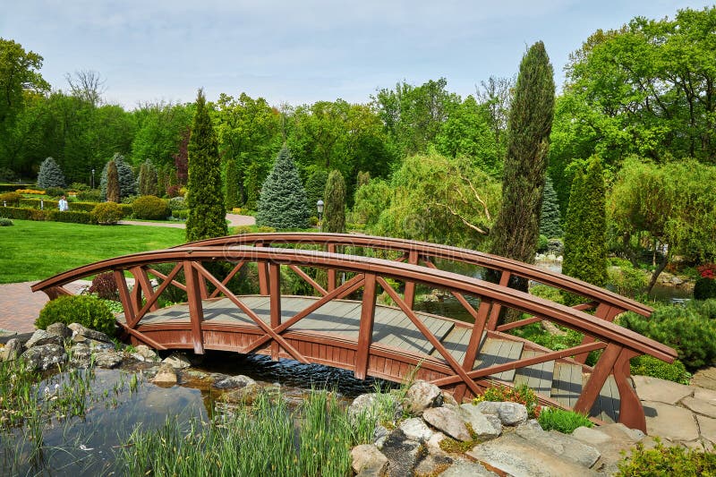 Wooden Bridge in a Park. Summer Park with Bridge Stock Photo - Image of ...
