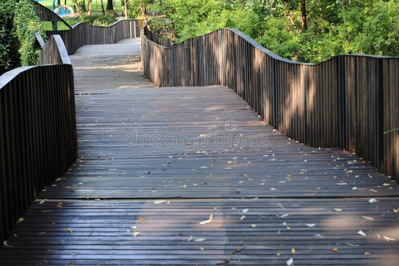 Wooden bridge pathway. stock image. Image of garden - 166409405