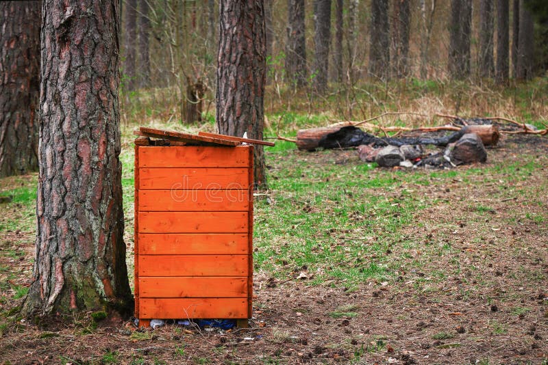 Wooden Brigh Orange Trash Bin in Forest Resting Spot between Tree ...
