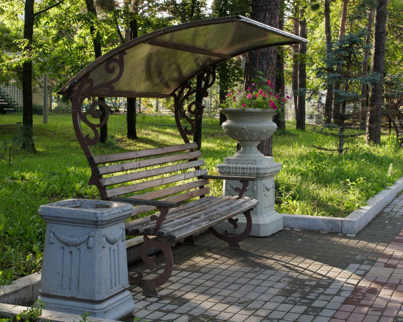 Wooden Brown Bench with Canopy in a City Park. Stock Photo - Image of ...