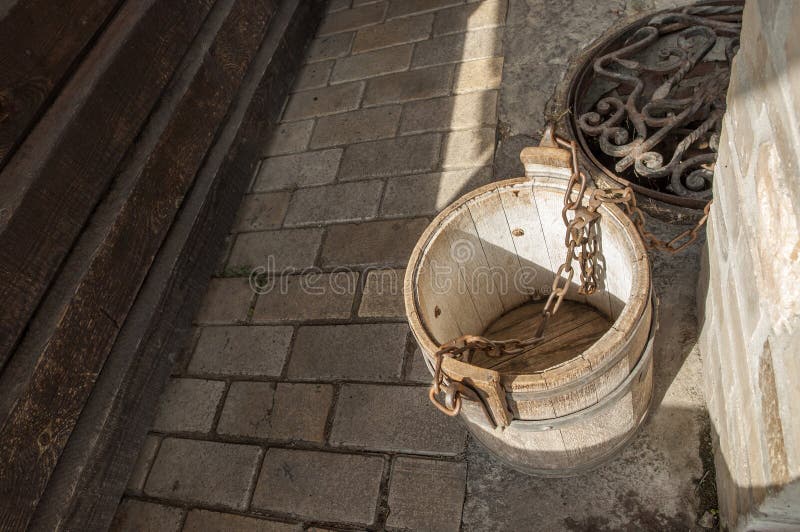 Wooden bucket with chain stock photo. Image of medieval - 59830950