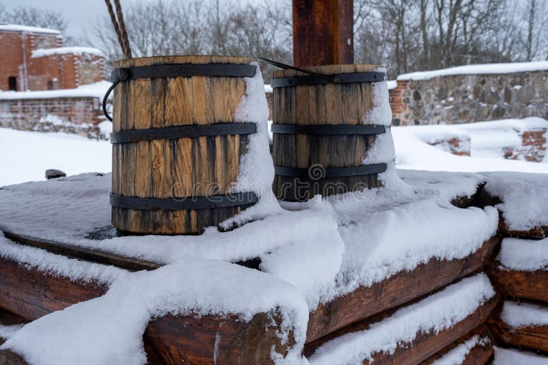 Wooden Bucket on the Edge of the Well in Winter Stock Photo - Image of ...