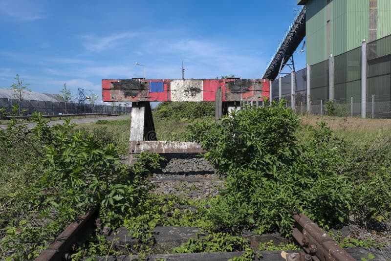 Wooden Buffer Stop with Red Stop Sign Ending Rail Tracks Concept for ...