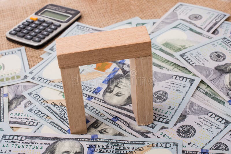Wooden Building Blocks on US Dollar Banknotes Stock Image - Image of ...