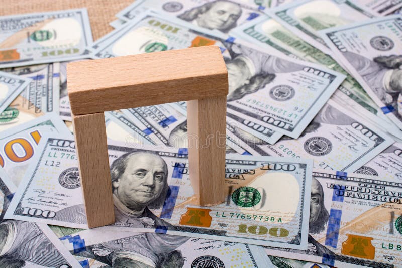 Wooden Building Blocks on US Dollar Banknotes Stock Photo - Image of ...