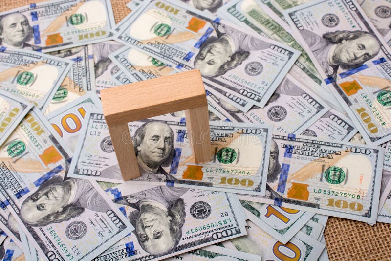 Wooden Building Blocks on US Dollar Banknotes Stock Photo - Image of ...