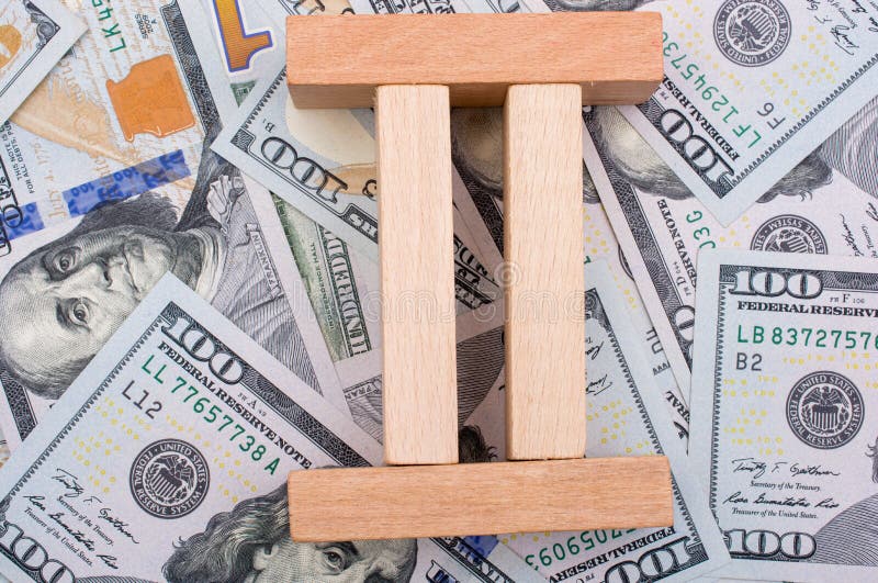 Wooden Building Blocks on US Dollar Banknotes Stock Image - Image of ...