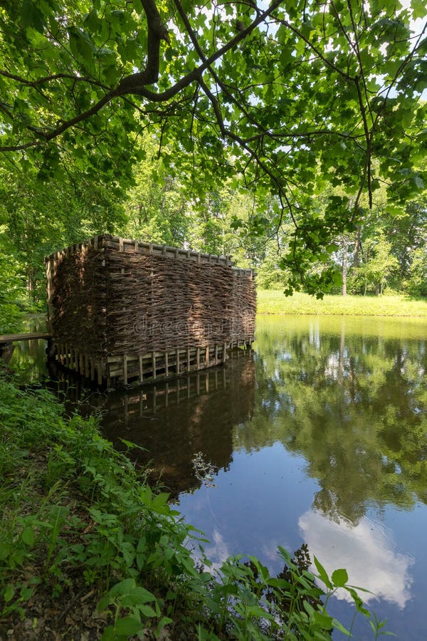 Wooden Building on the Shore of the Pond. Wicker Building in the Forest ...