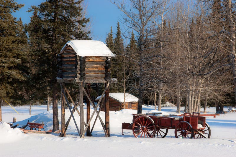 A Wooden Cache and Old Wagon Stock Photo - Image of landmark, snow ...