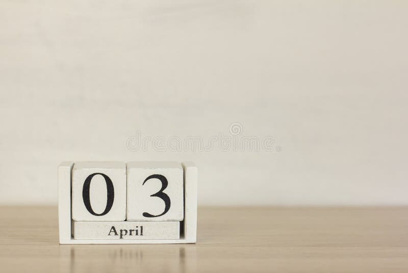 A Wooden Calendar with the Date April 3 on the Desktop Stock Image ...