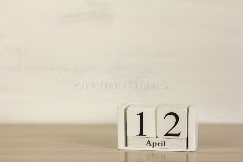 A Wooden Calendar with the Date April 12 on the Desktop Stock Image ...