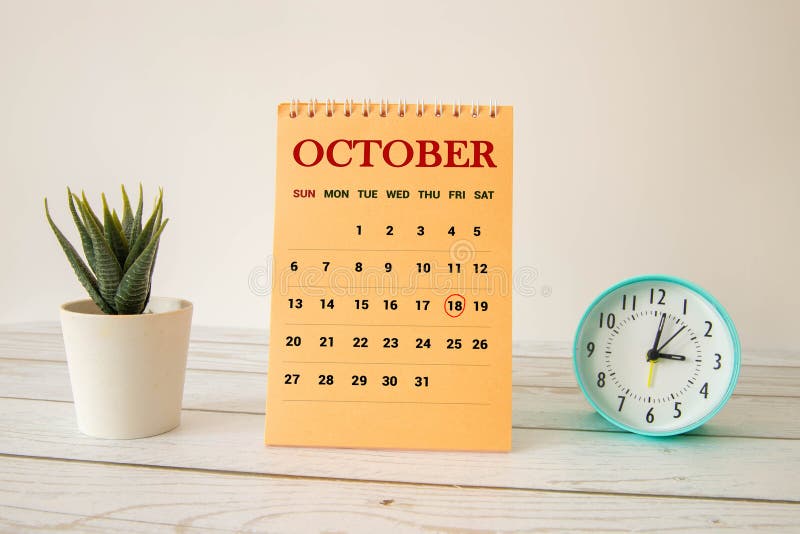 Wooden Calendar with the Date October 18 on Desktop with Laptop Stock ...